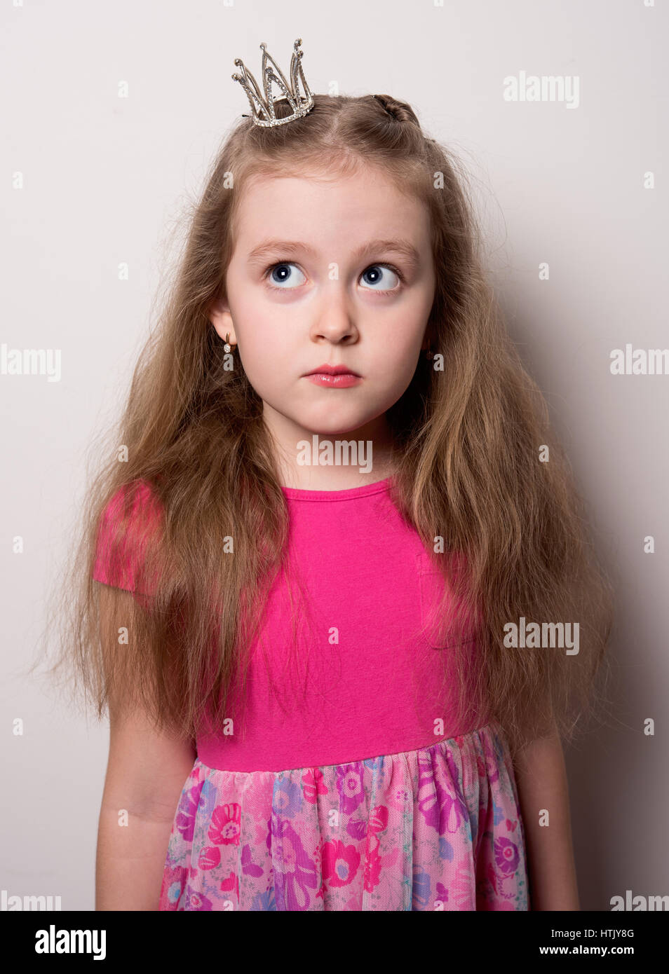 young Princess in a pink dress and crown Stock Photo - Alamy