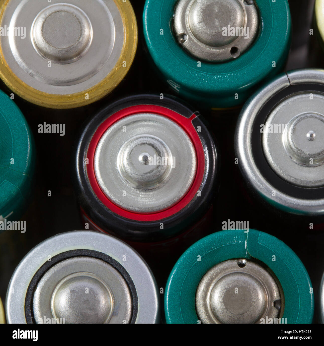 Close-up top view of alkaline AA batteries alluding concepts of power ...