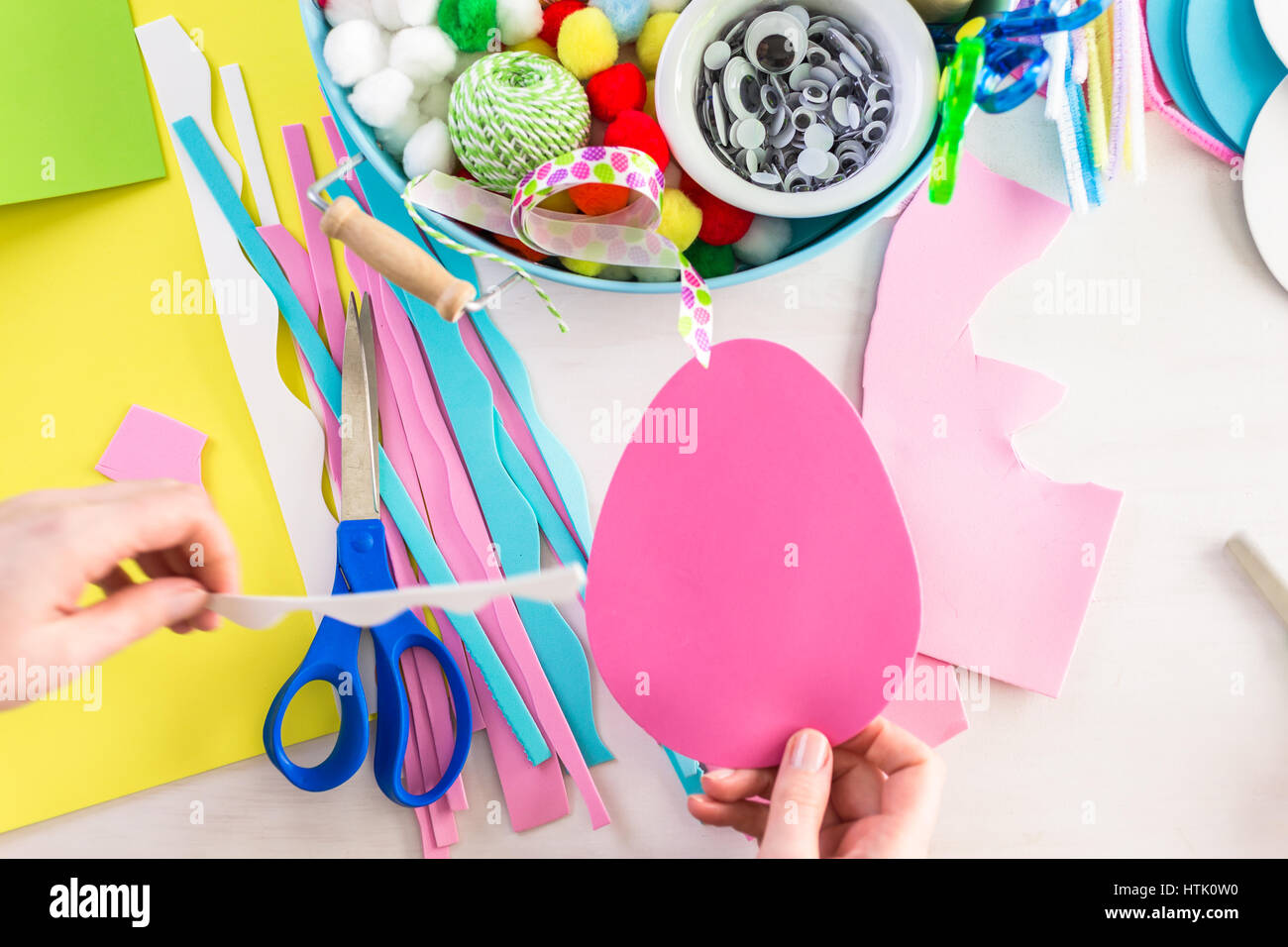 Step by step. Mother and daughter decorating paper Easter eggs Stock ...