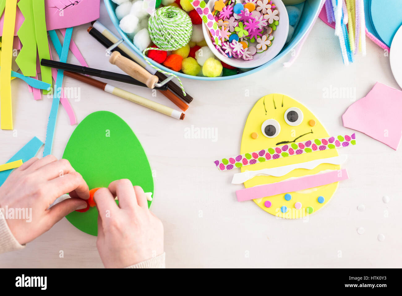 Step by step. Mother and daughter decorating paper Easter eggs Stock ...