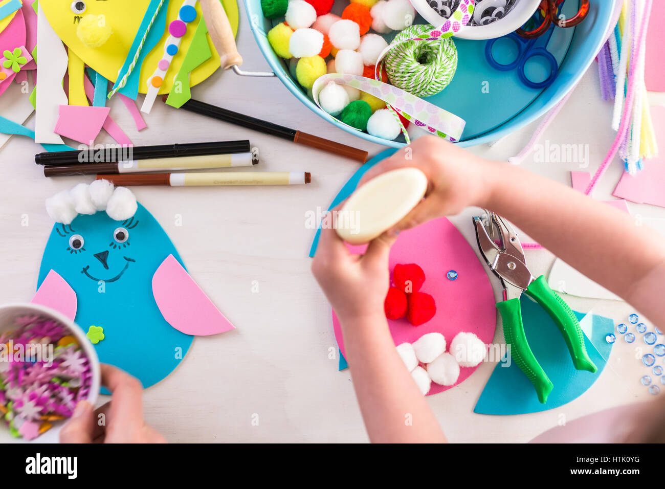 Step by step. Mother and daughter decorating paper Easter eggs Stock ...