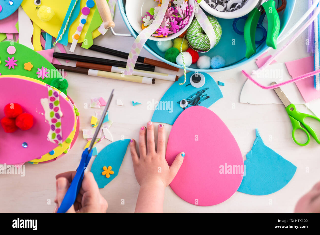 Step by step. Mother and daughter decorating paper Easter eggs Stock ...