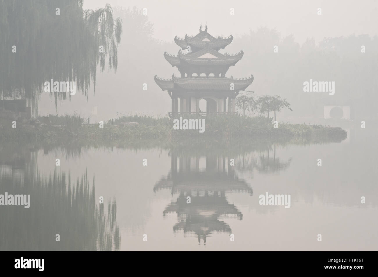 A chinese pavilion in the fog Stock Photo - Alamy