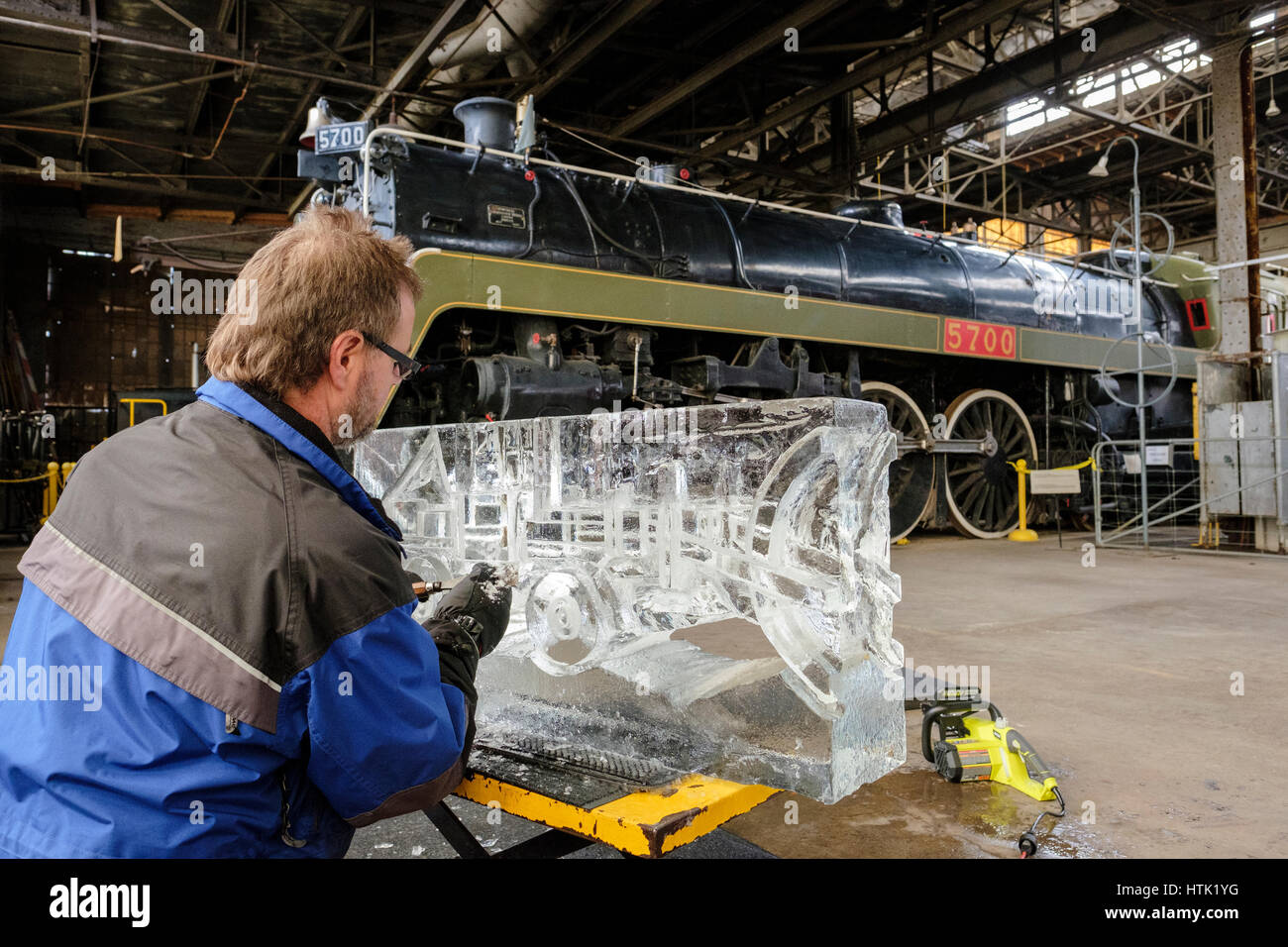 Ice carver sculpting the Canadian National Railway K-5-a Hudson, 1930 ...