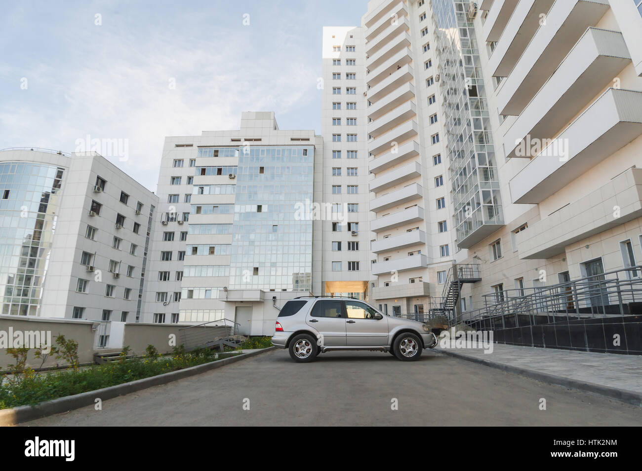 Car in a courtyard on a city street on a background of urban ...