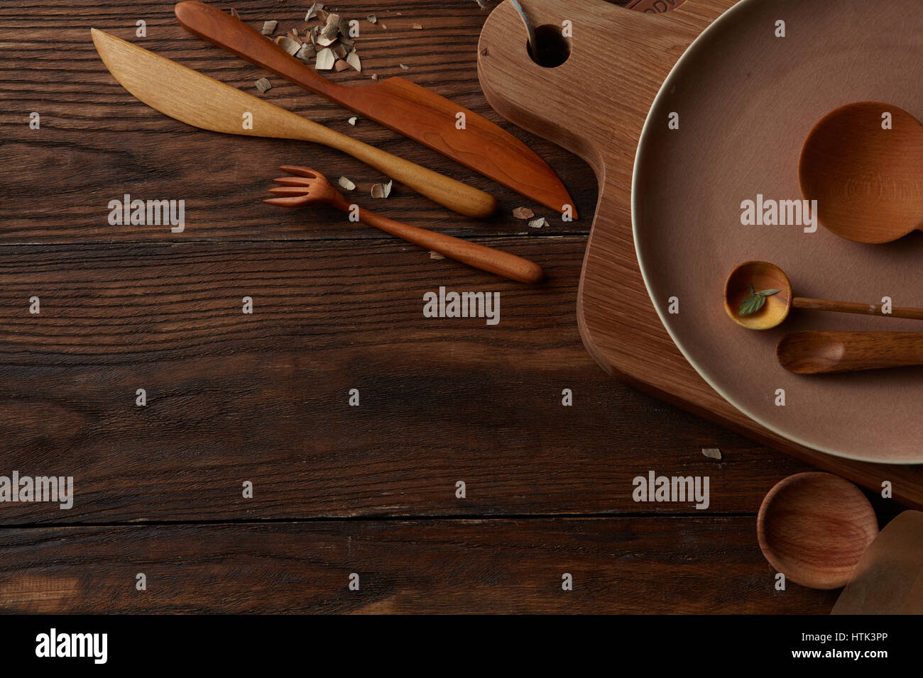 Plank with baking parchment in kitchen. Composition of kitchen devices ...