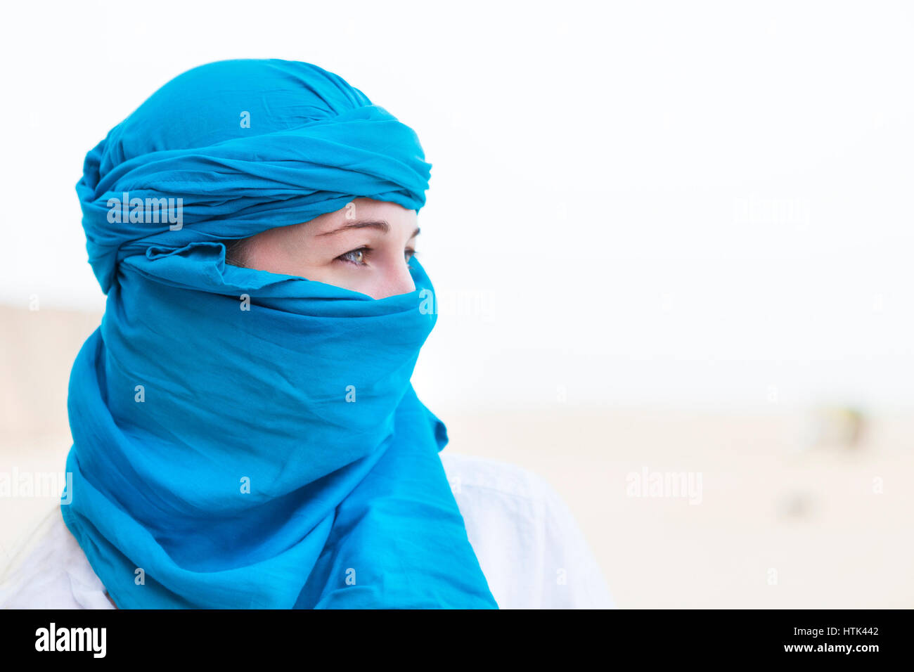 Portrait of beautiful arabic woman face posing on sunset background ...
