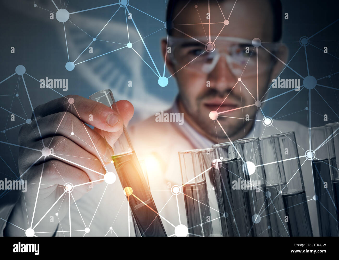 Portrait of concentrated male scientist working with reagents in ...