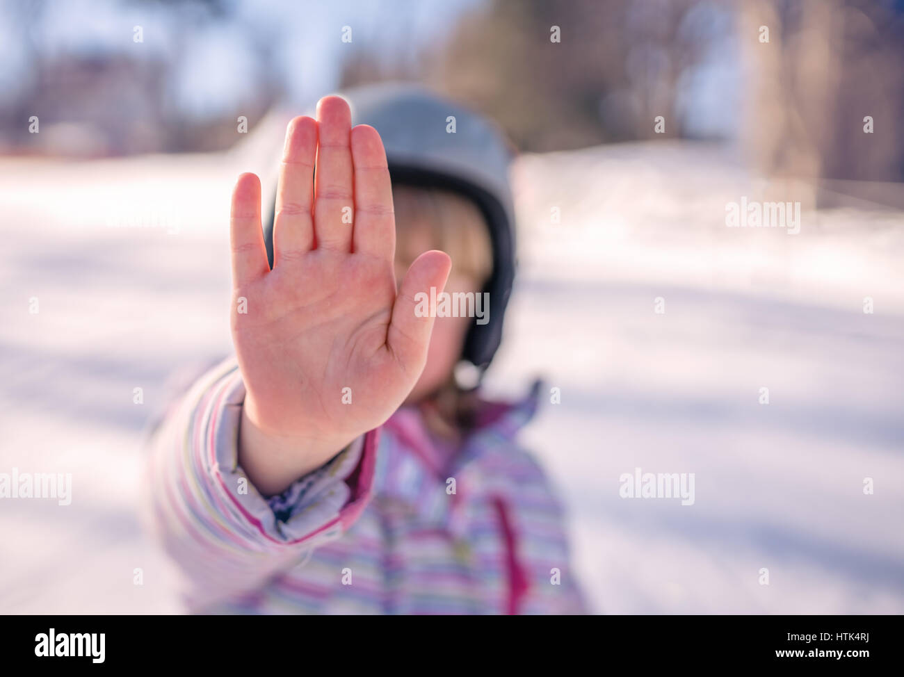 Portrait of young caucasian girl showing stop hand sign in front of her ...
