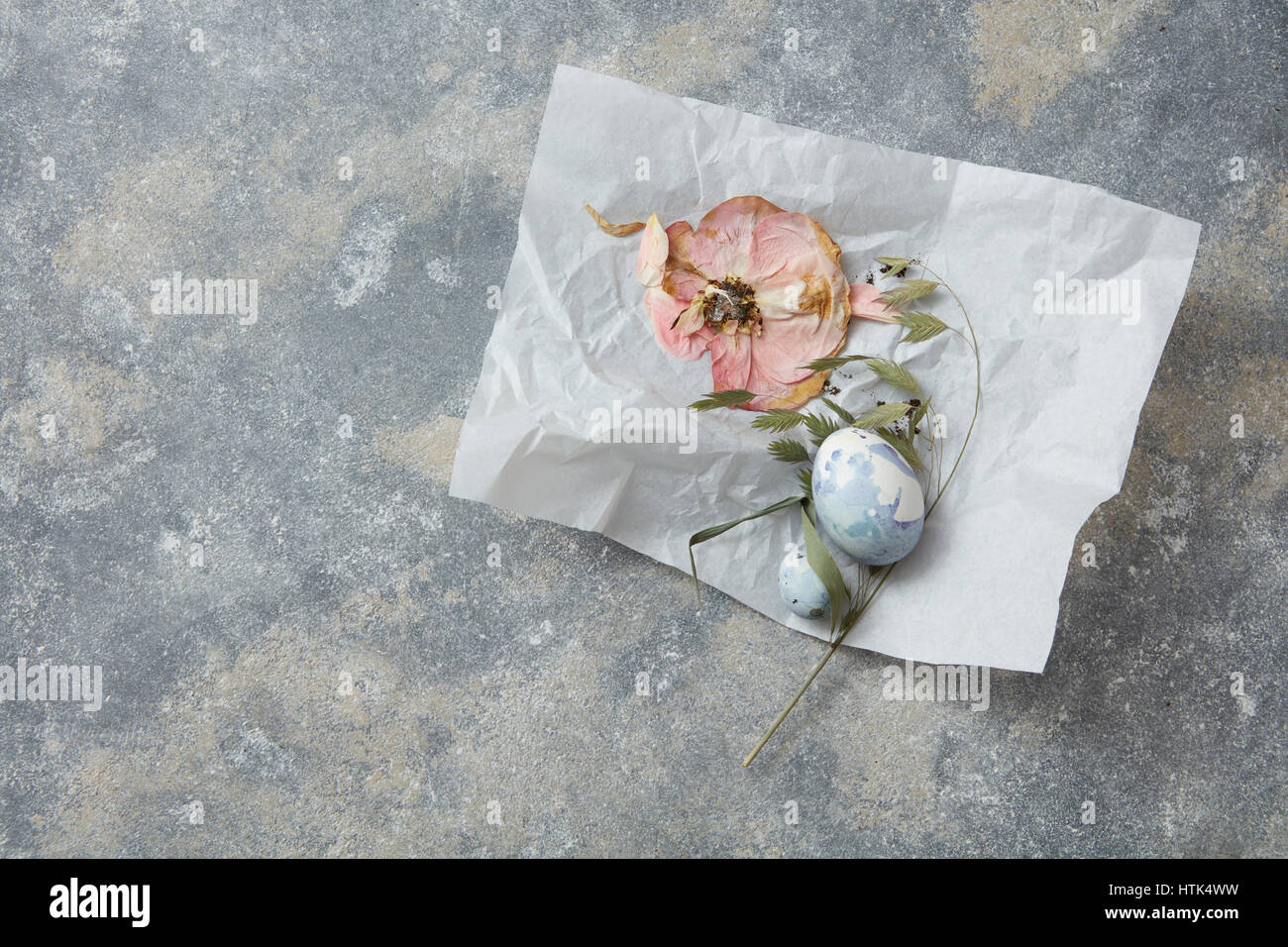 Easter eggs on paper with flowers decoration on stone background Stock ...