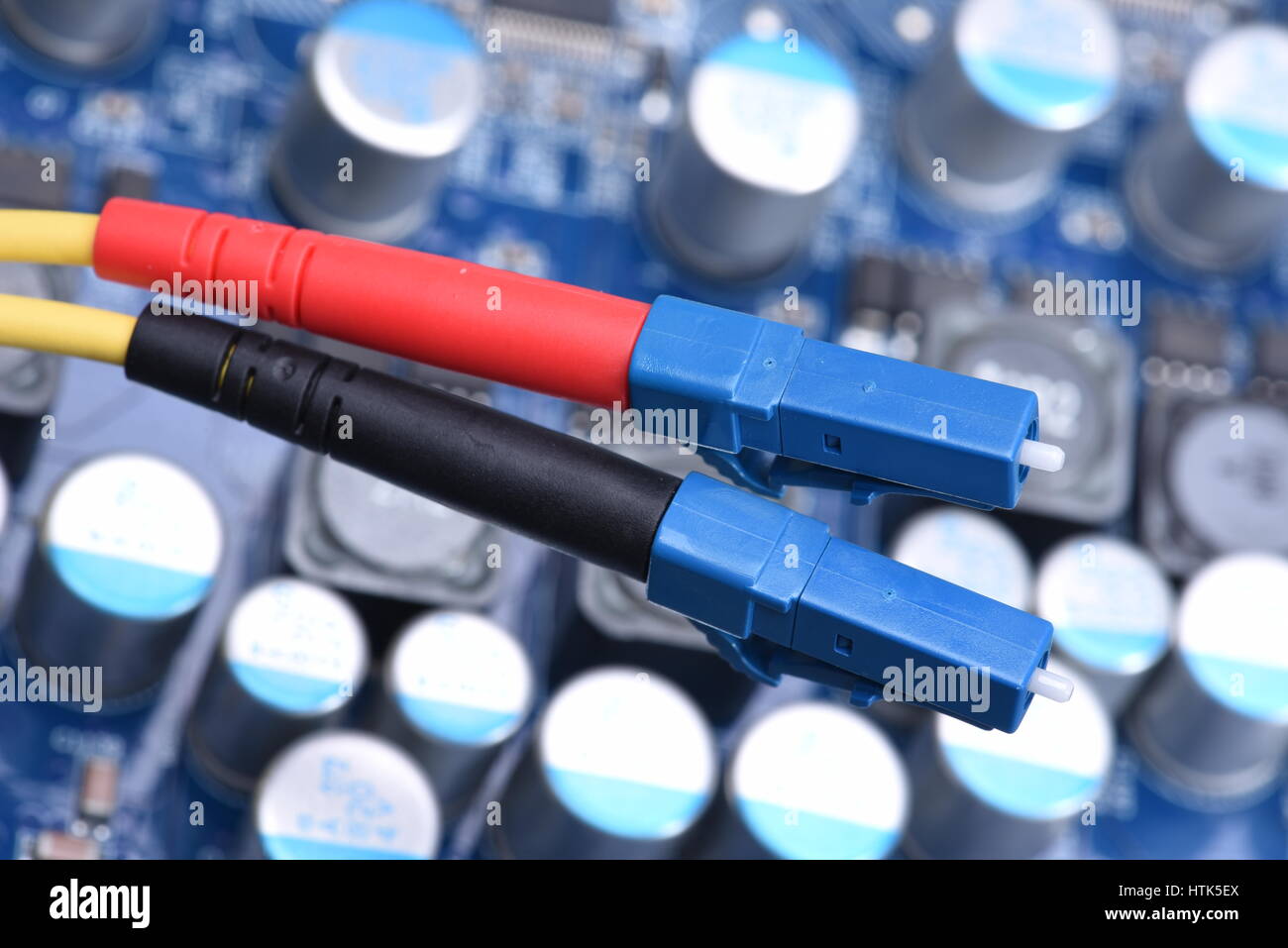 Fiber Optical Network Cables Close-up with Electronic Board in ...