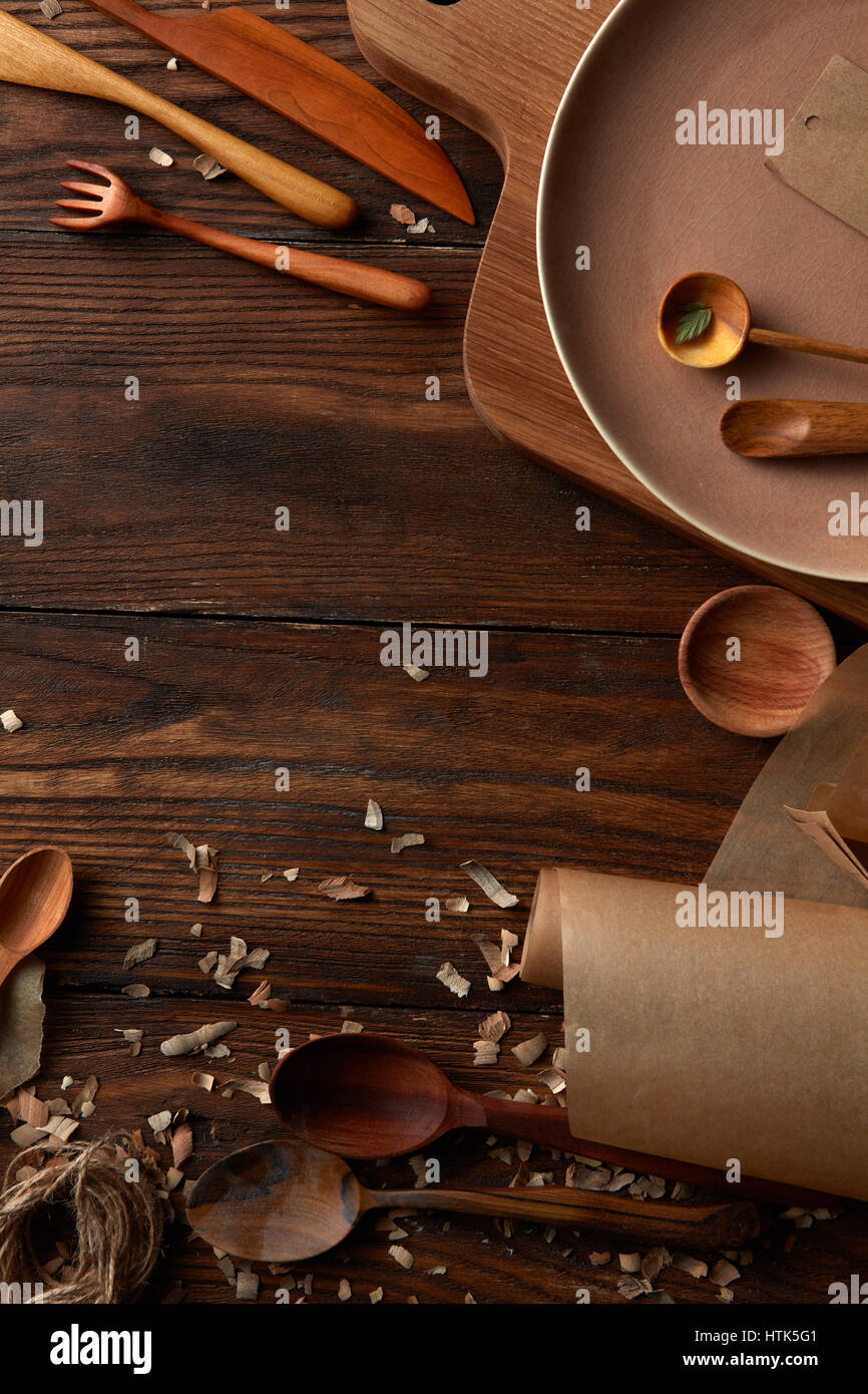 Set of dishes and cutlery on wooden table Stock Photo - Alamy