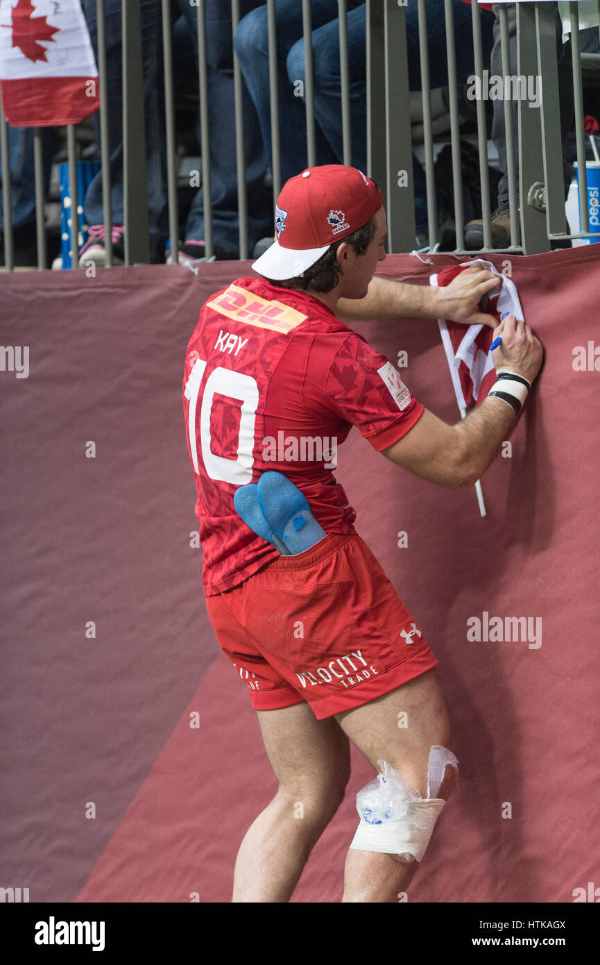 Vancouver, Canada. 12th Mar, 2017. Pat Kay (10) of Canada, signing ...