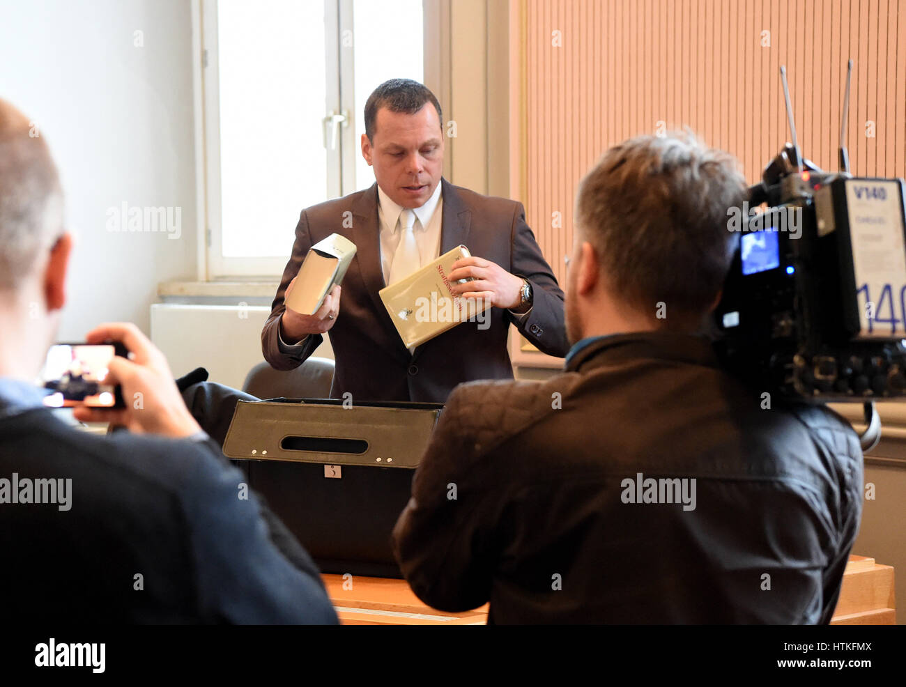 Kiel, Germany. 13th Mar, 2017. State Prosecutor Michael Bimler unpacks ...