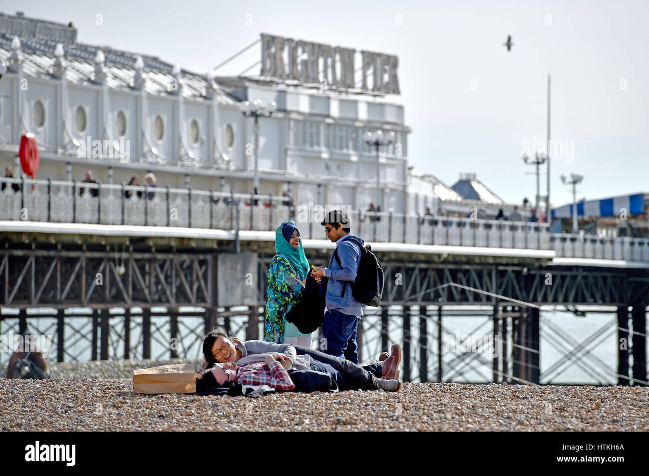 Women enjoy the sunshine in brighton hi-res stock photography and ...