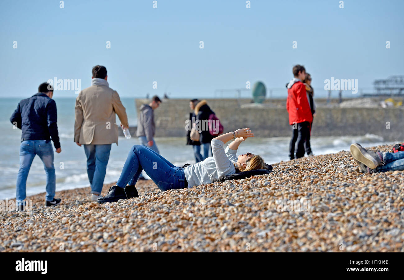 Brighton, UK. 13th Mar, 2017. Brighton beach is busy as people enjoy ...