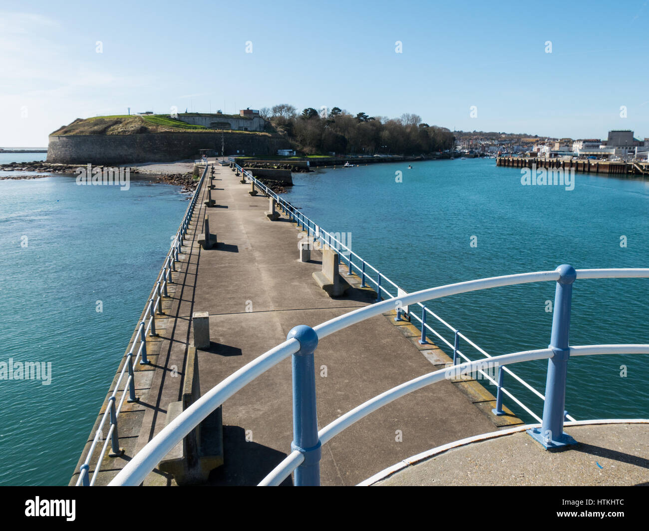 Weymouth, Dorset, UK. 13th March 2017. The stone jetty at Weymouth ...
