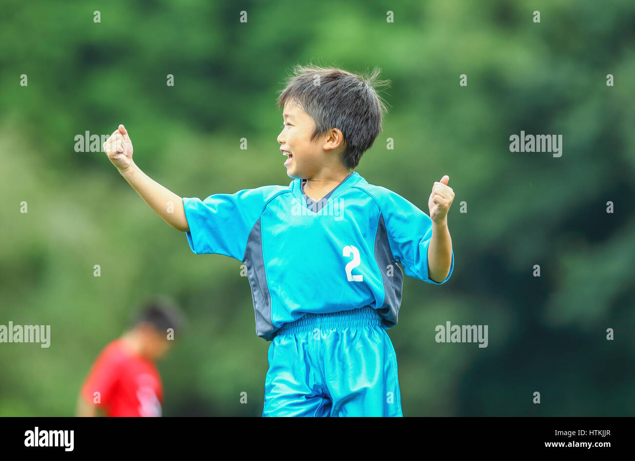 Japanese kid playing soccer Stock Photo - Alamy