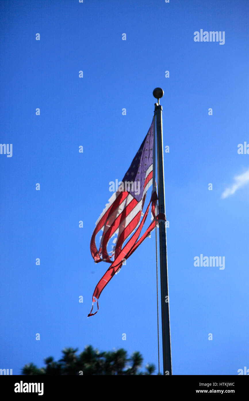 A tattered American flag symbolizes the republic's distress Stock Photo ...