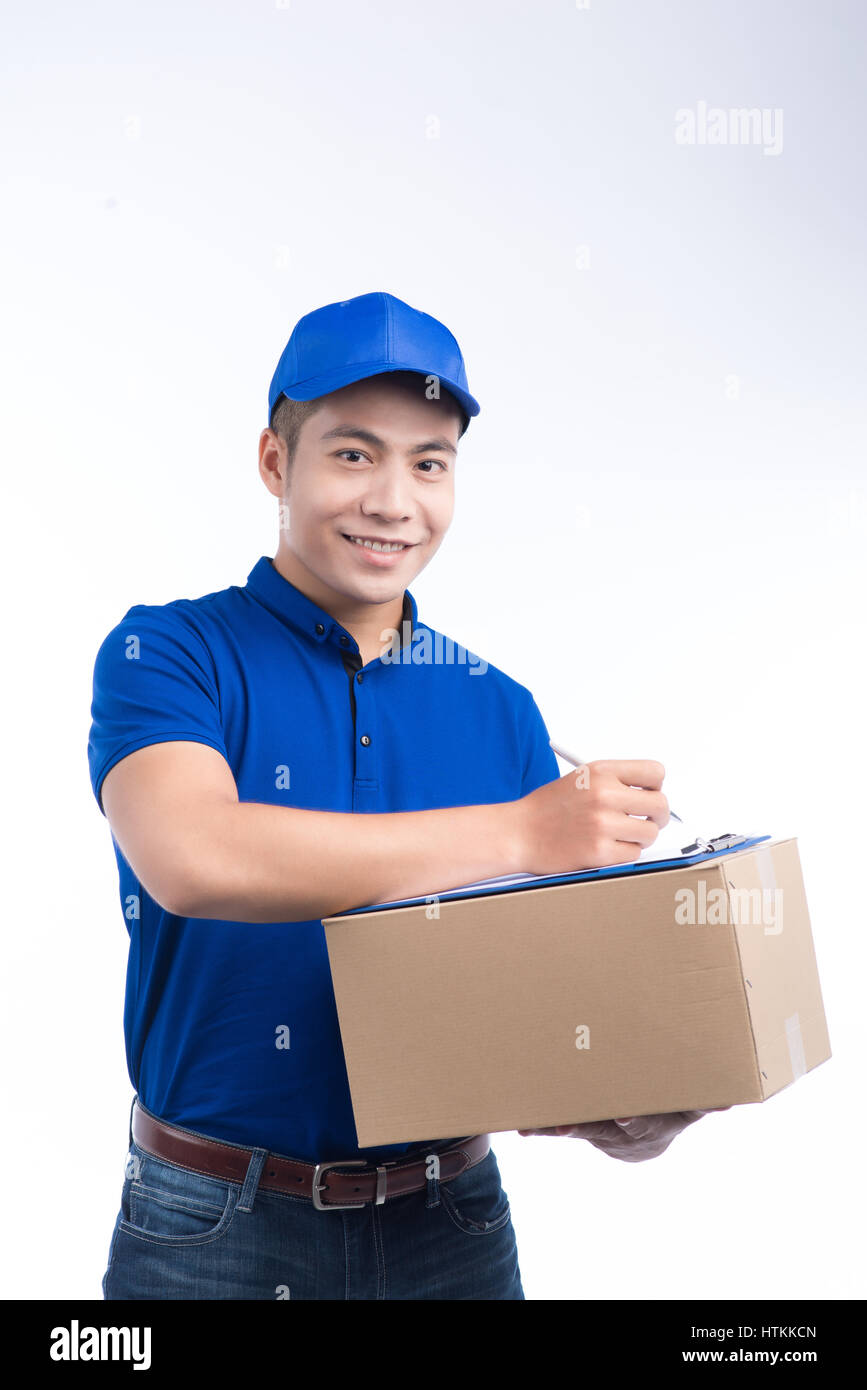 Delivery man writing down notes on clipboard isolated over white ...
