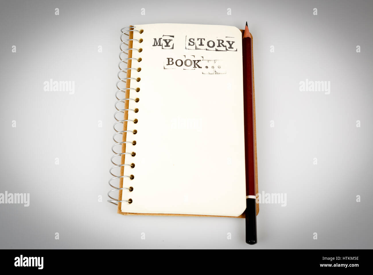 My story book on the white, Diary with text and pencil Stock Photo - Alamy