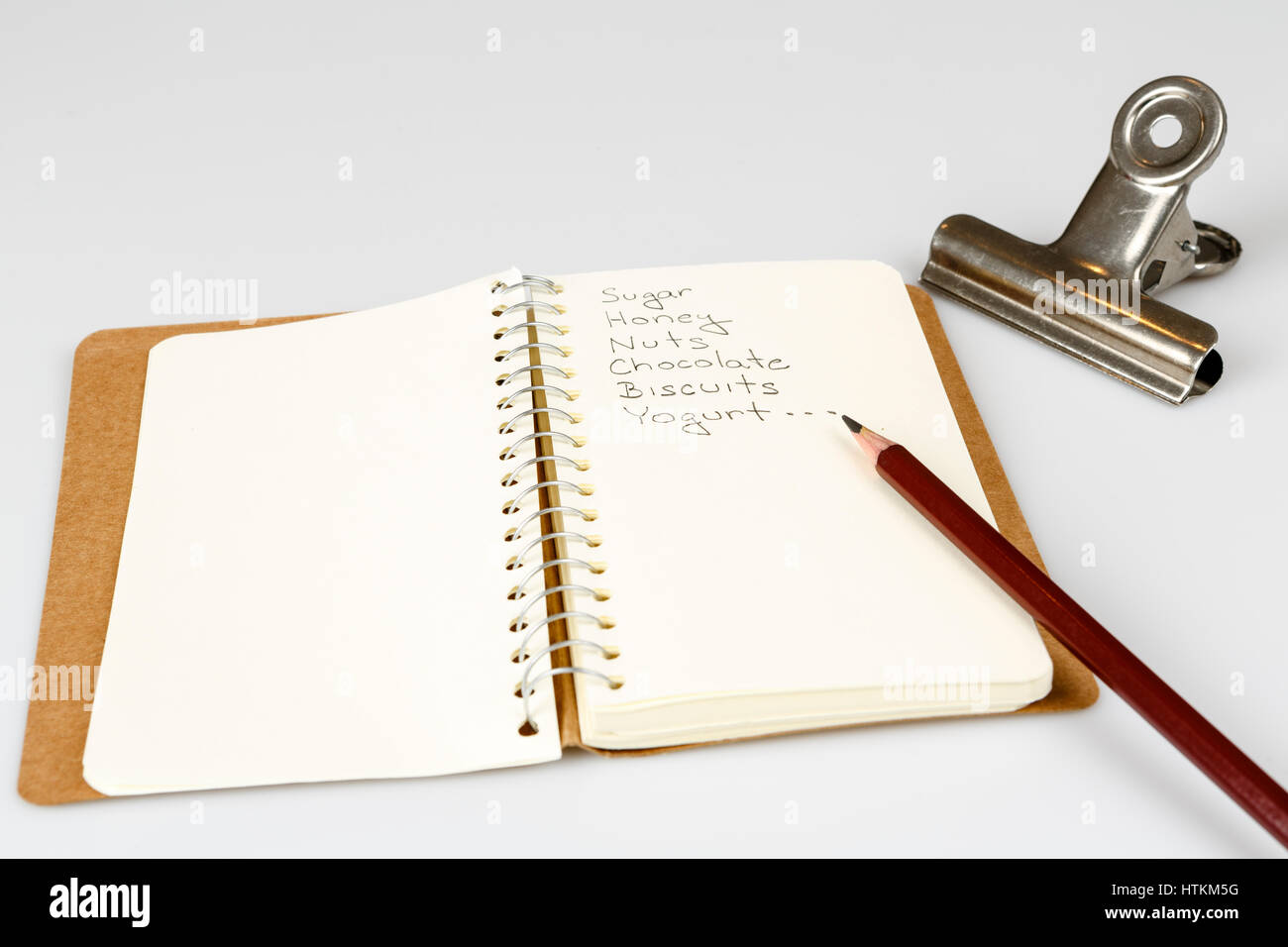 shopping list in the diary with pencil on white Stock Photo - Alamy