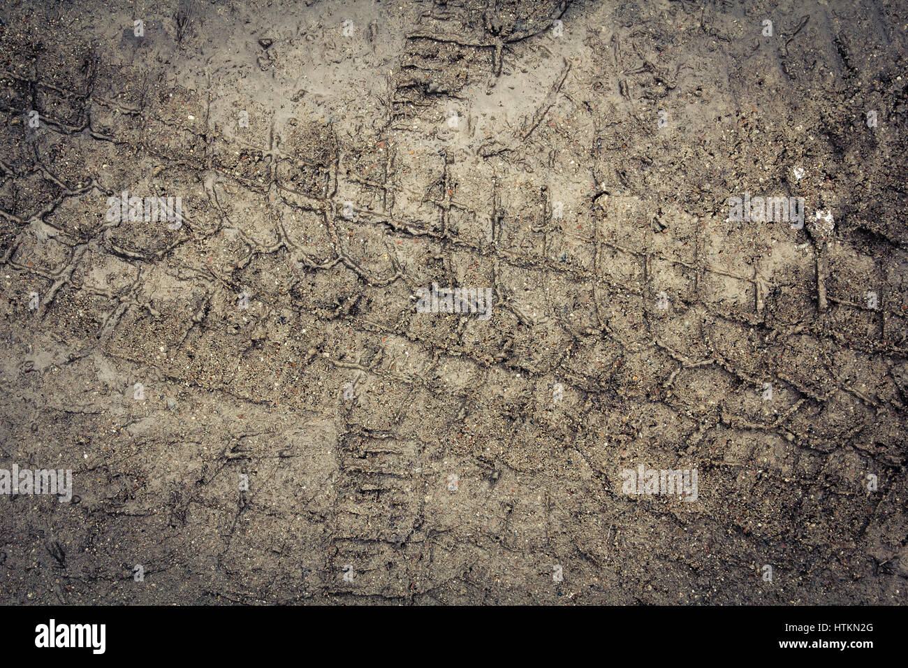 Tire tracks on a wet muddy road, abstract background Stock Photo - Alamy