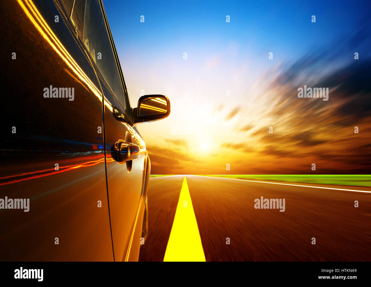 A car driving on a motorway at high speeds, overtaking other cars Stock ...