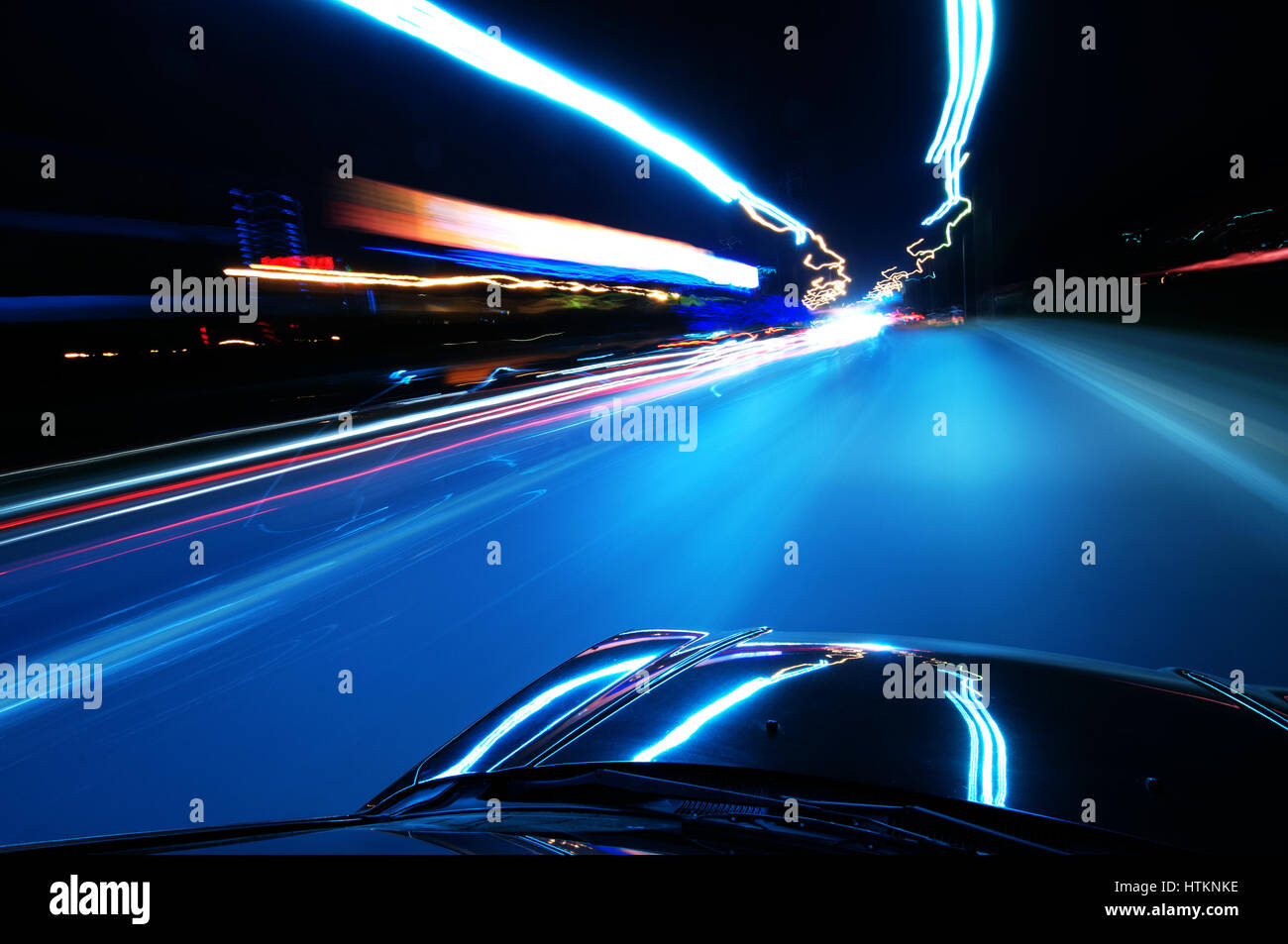 A car driving on a motorway at high speeds, overtaking other cars Stock ...