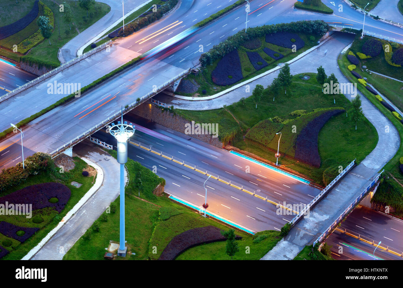 Freeway in night with cars light in modern city Stock Photo - Alamy