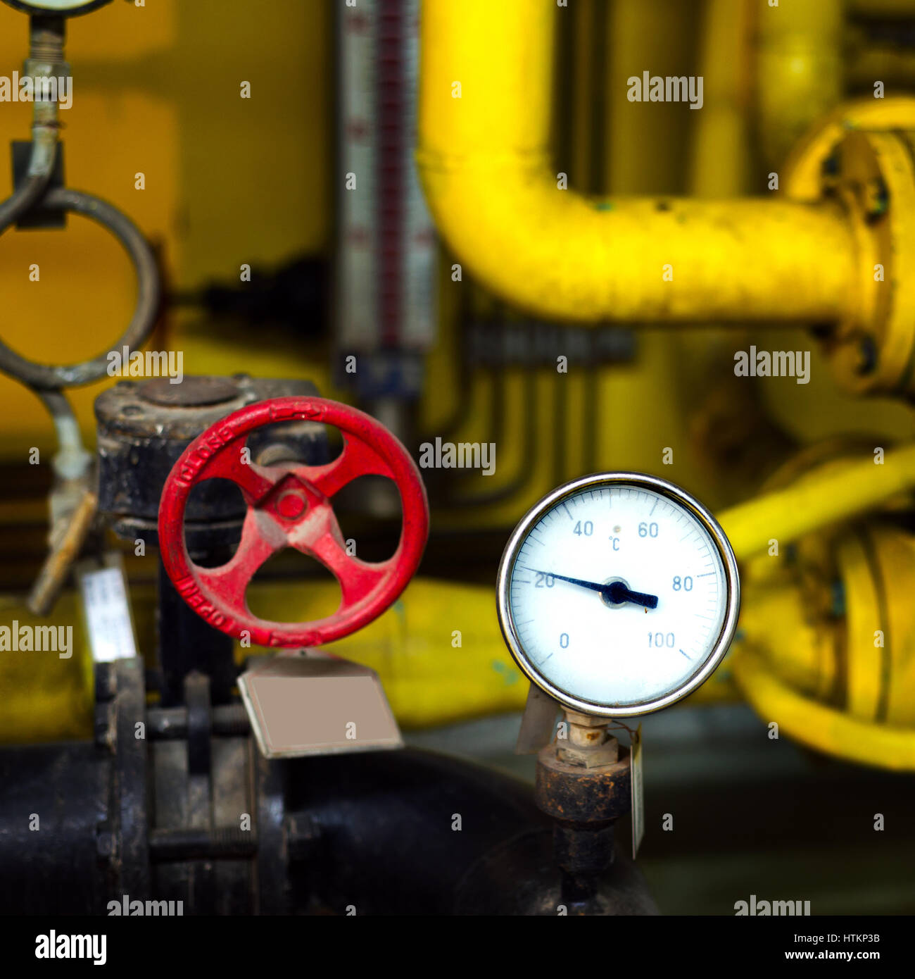 Closeup of manometer, pipes and faucet valves of heating system in a ...