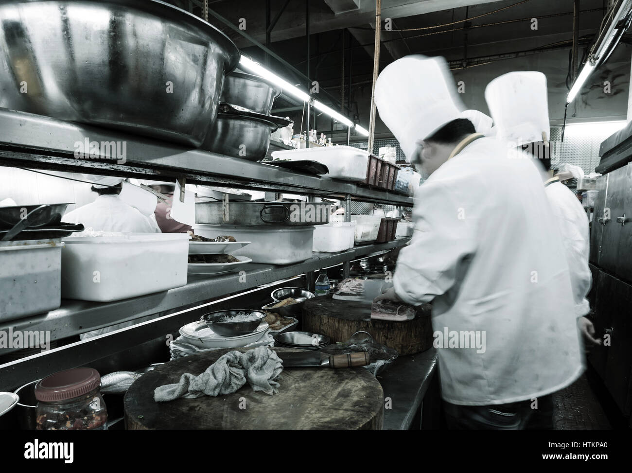 Crowded kitchen, a narrow aisle, working chef Stock Photo - Alamy