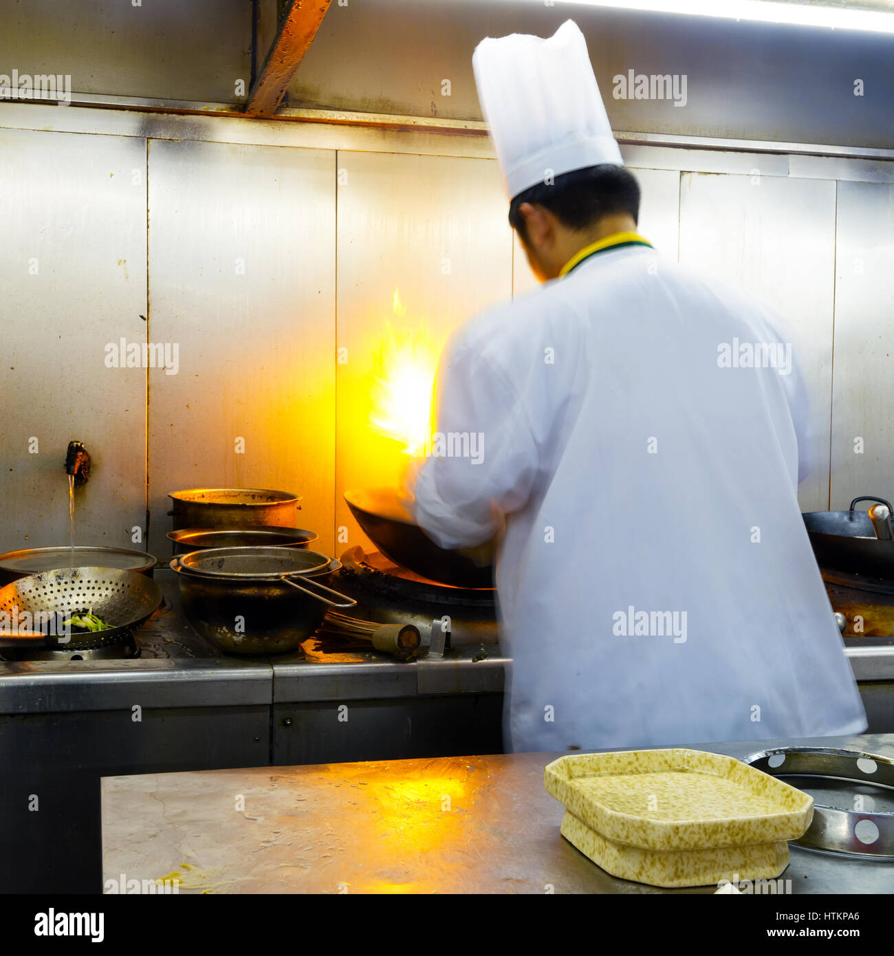 Crowded kitchen, a narrow aisle, working chef Stock Photo - Alamy