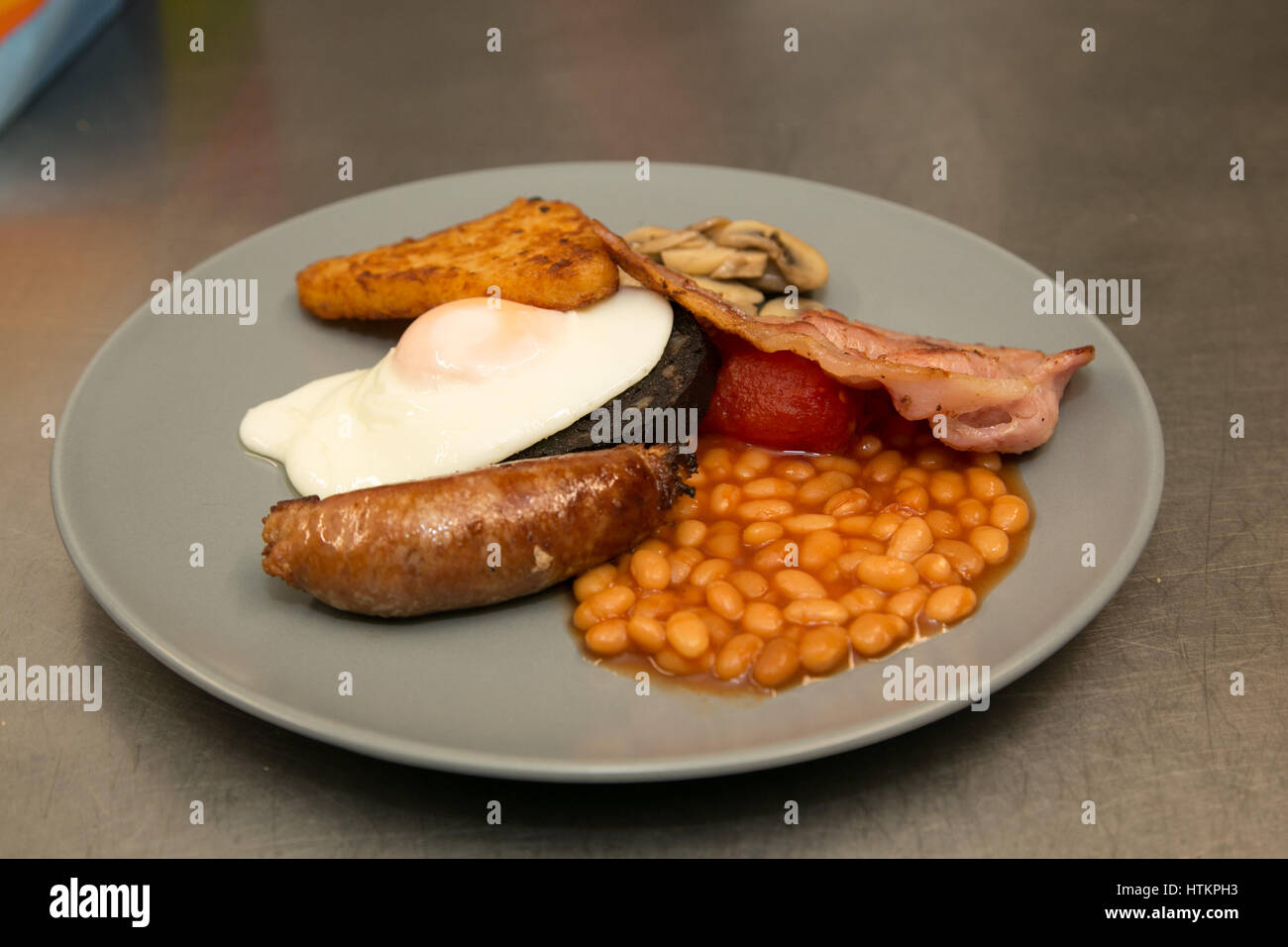 Traditional English cooked breakfast on a greay plate Stock Photo - Alamy