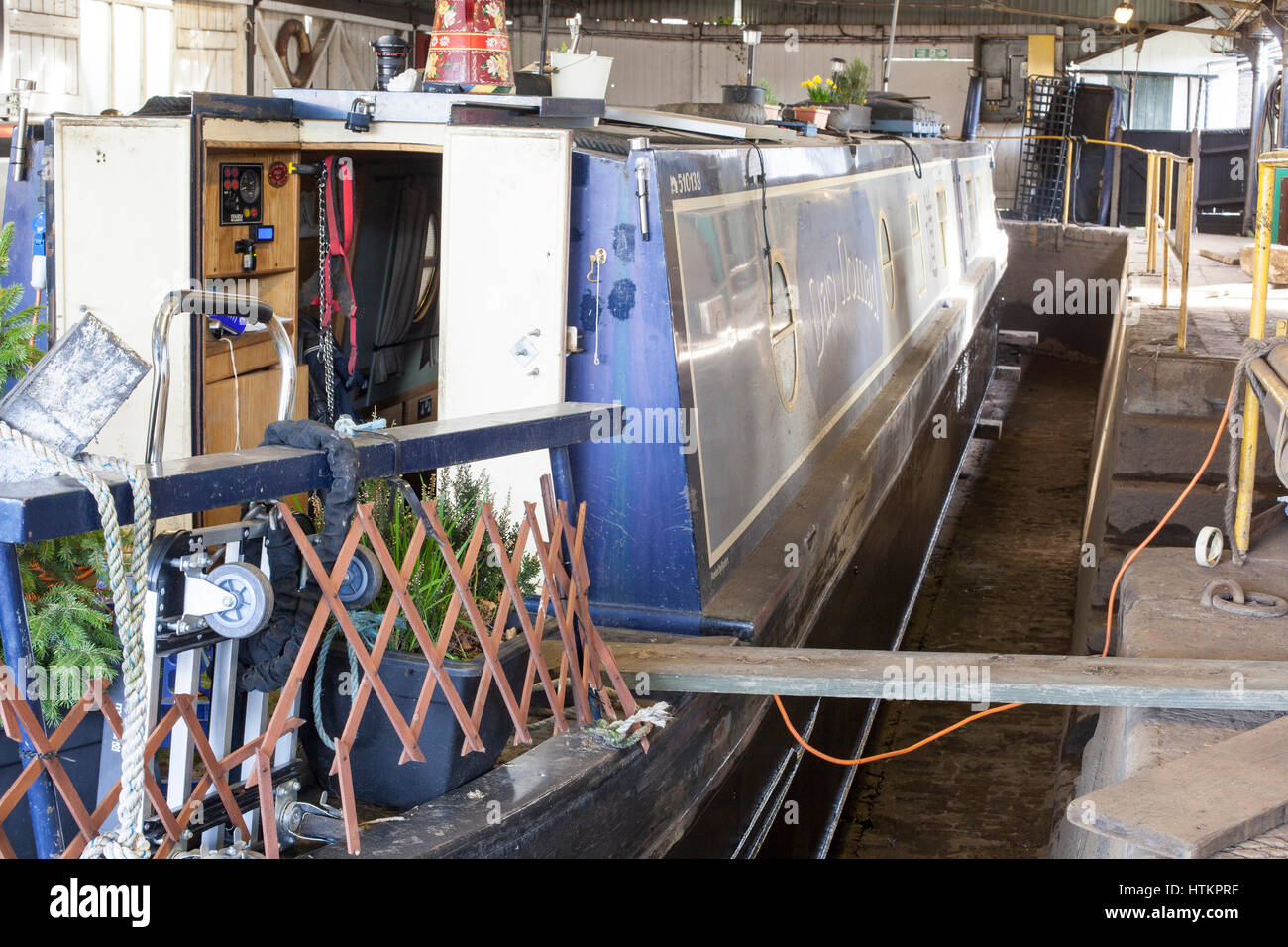 Narrow boat in dry dock for blacking Stock Photo - Alamy