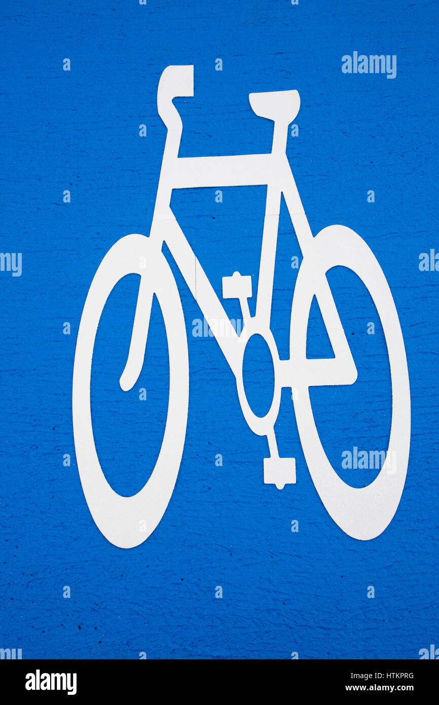 White bicycle road sign on blue background Stock Photo - Alamy