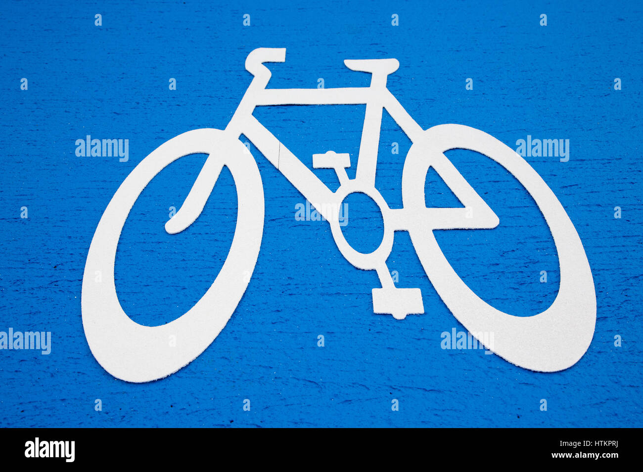 White bicycle road sign on blue background Stock Photo - Alamy