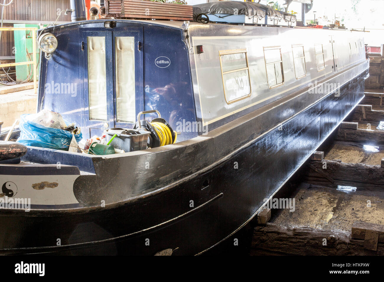 Narrow boat in dry dock for blacking Stock Photo - Alamy