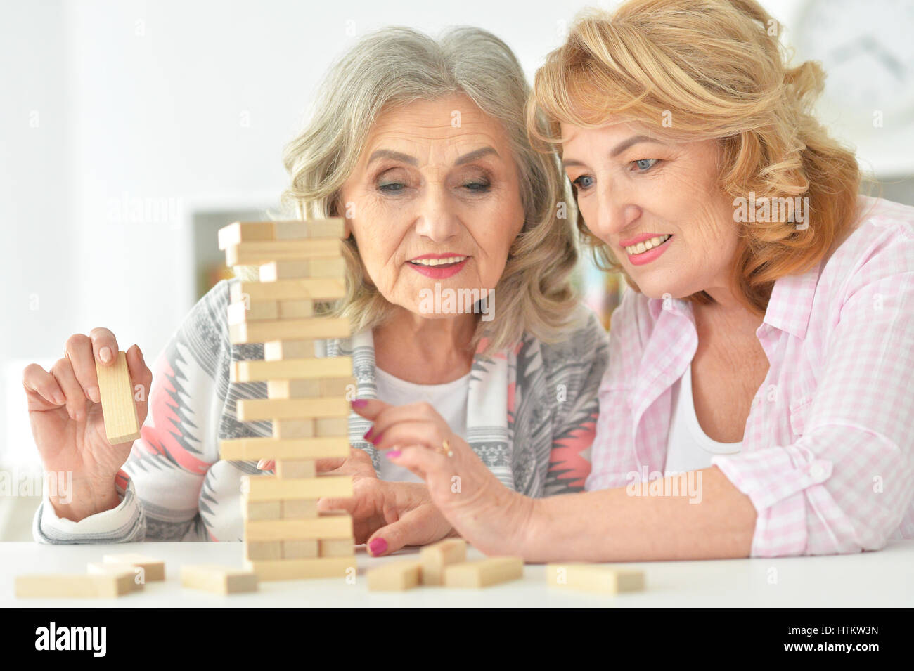 Family playing a board game portrait hi-res stock photography and ...