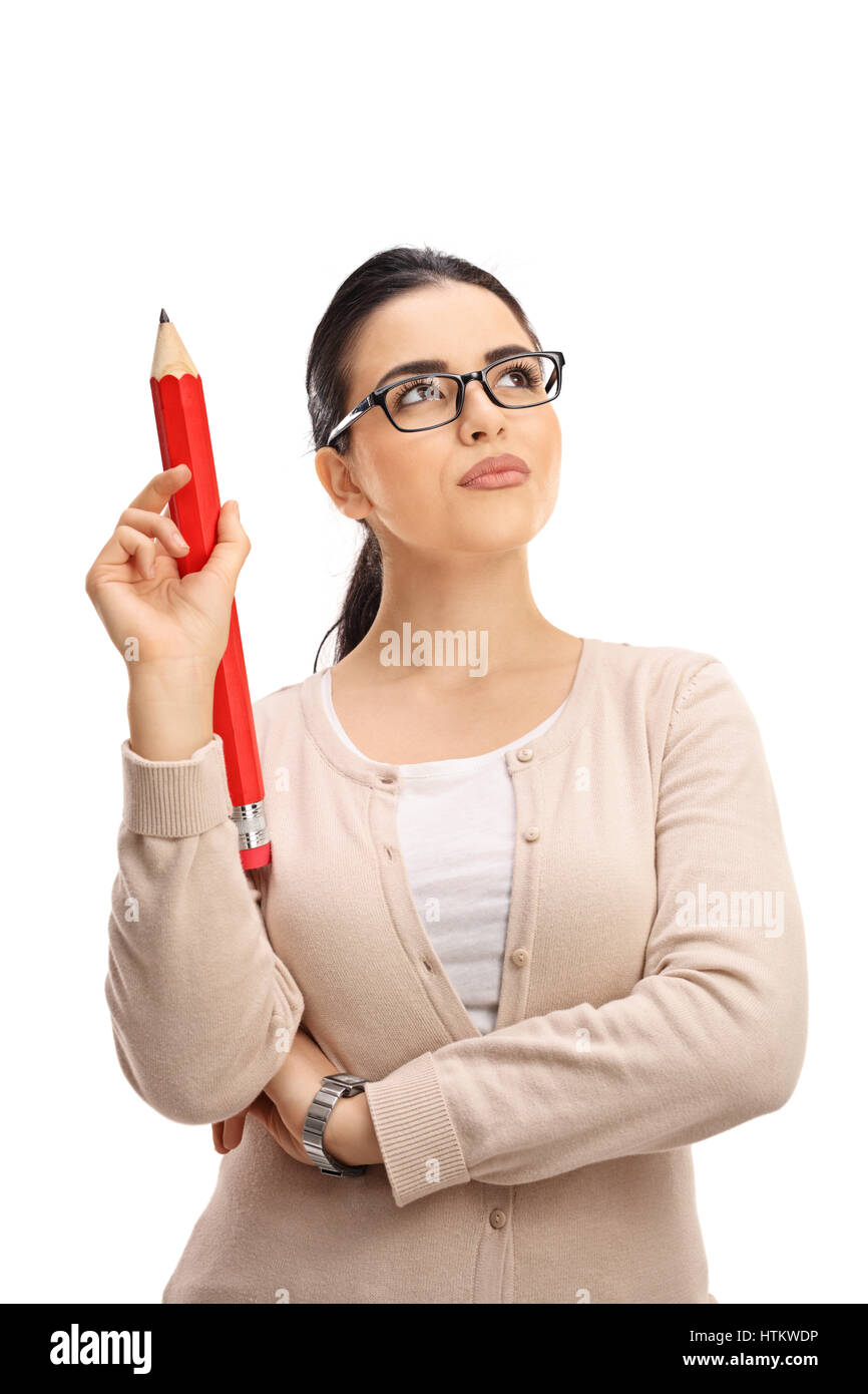 Pensive female professor with a big red pencil isolated on white ...