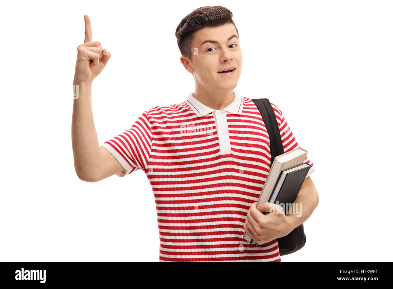 Teenage student pointing up with his finger isolated on white ...