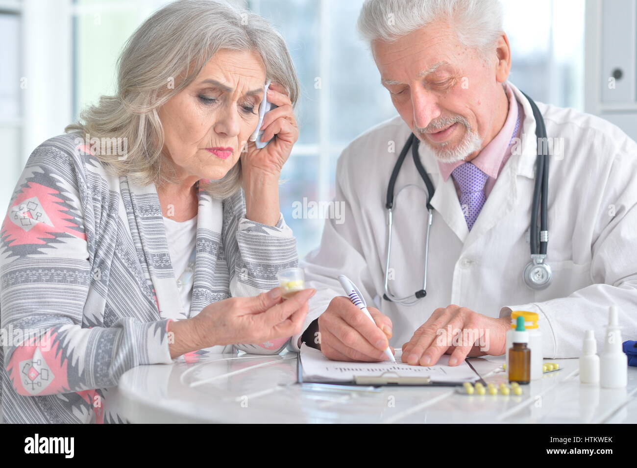 Portrait of a sick elderly woman in a doctor's office Stock Photo - Alamy