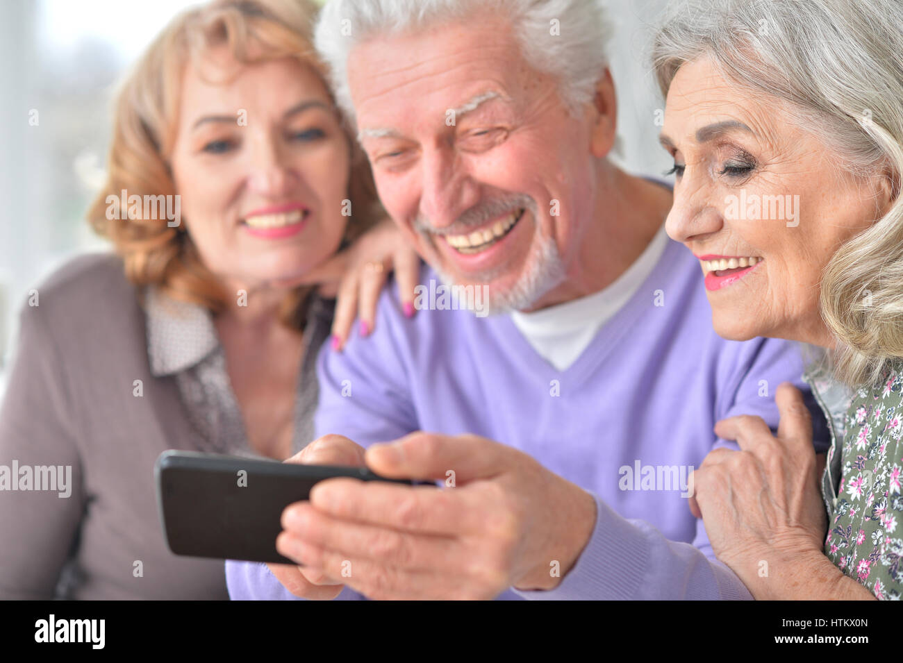 Portrait of elderly people using mobile phone Stock Photo - Alamy