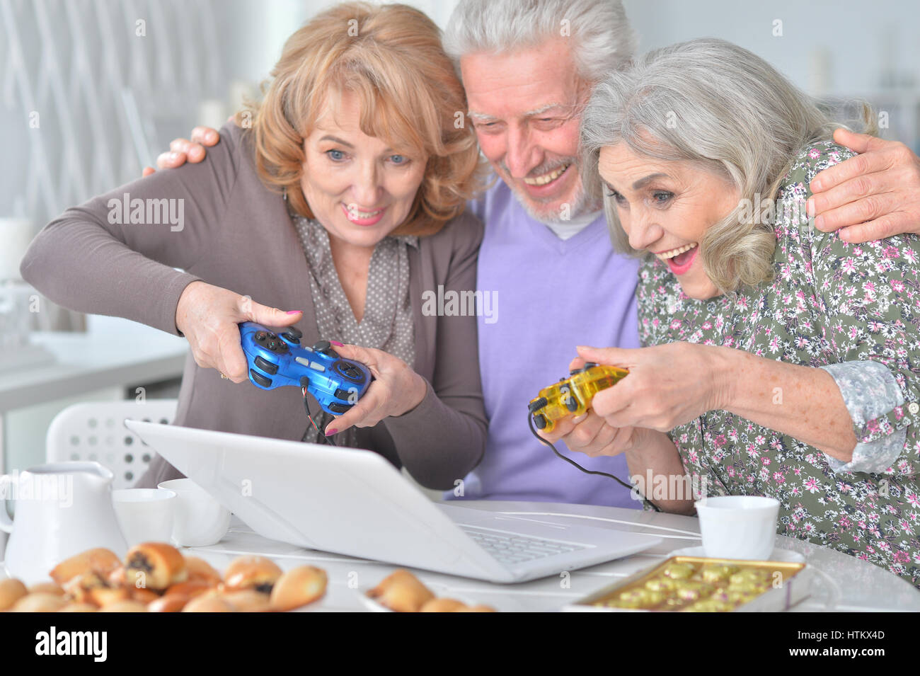 Portrait of elderly people playing computer game Stock Photo - Alamy