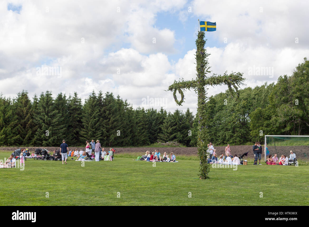 Beautifully decorated typical swedish Maypole with swedish flag on top ...
