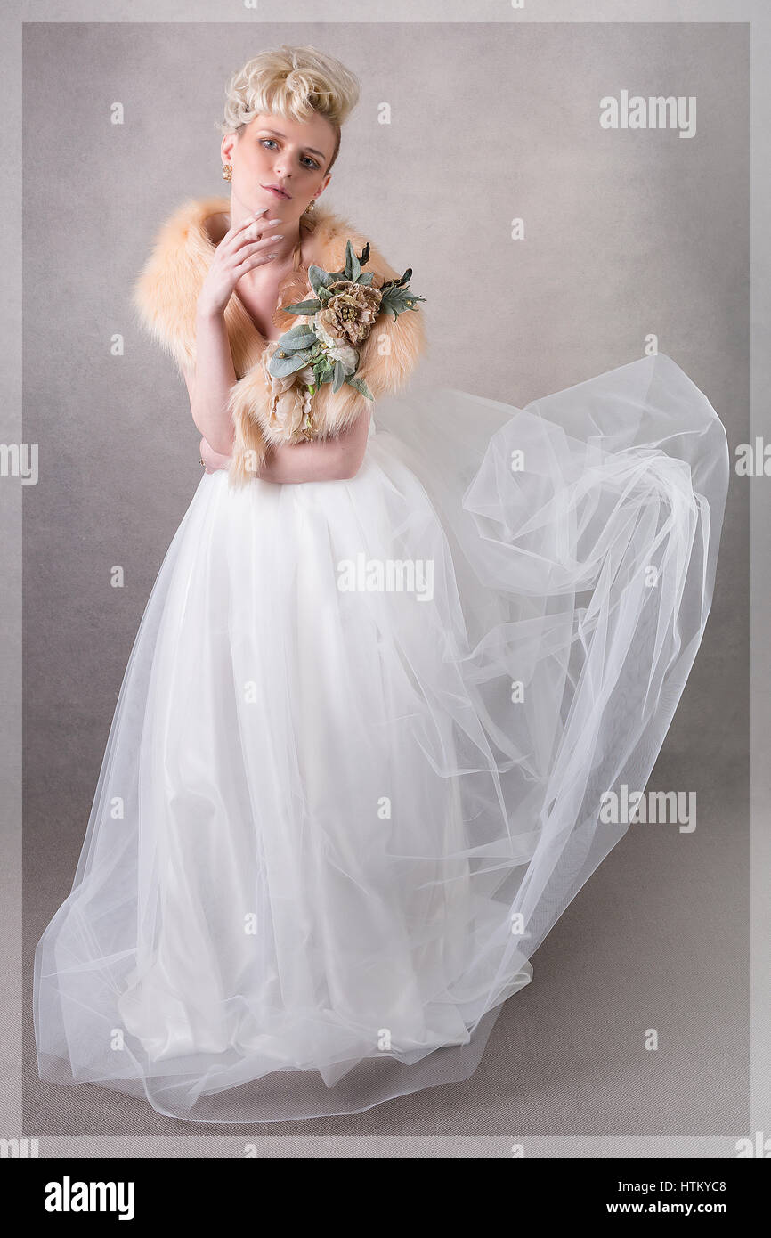 Blonde girl modeling a dress Stock Photo - Alamy