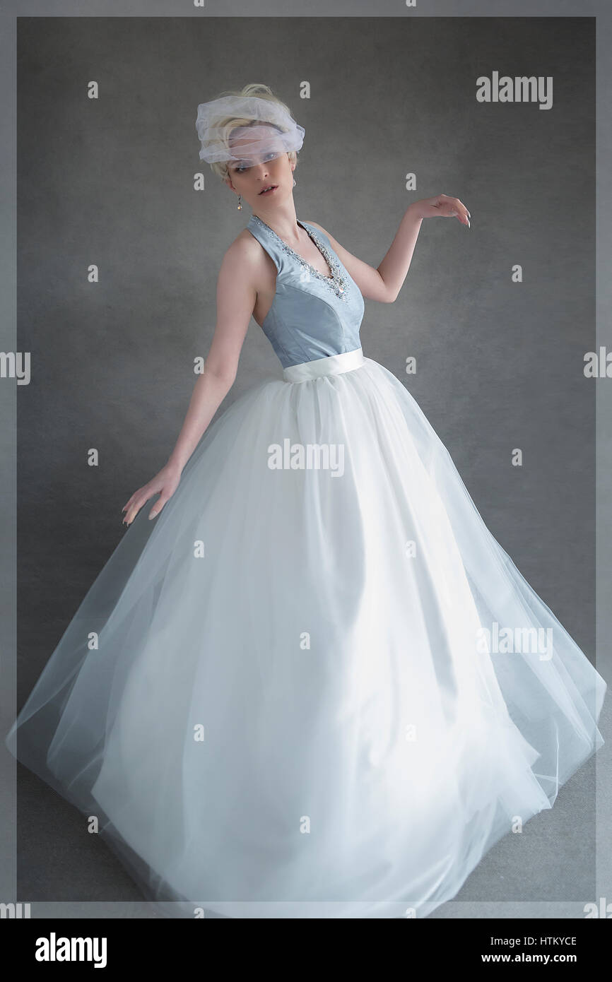Blonde girl modeling a dress Stock Photo - Alamy