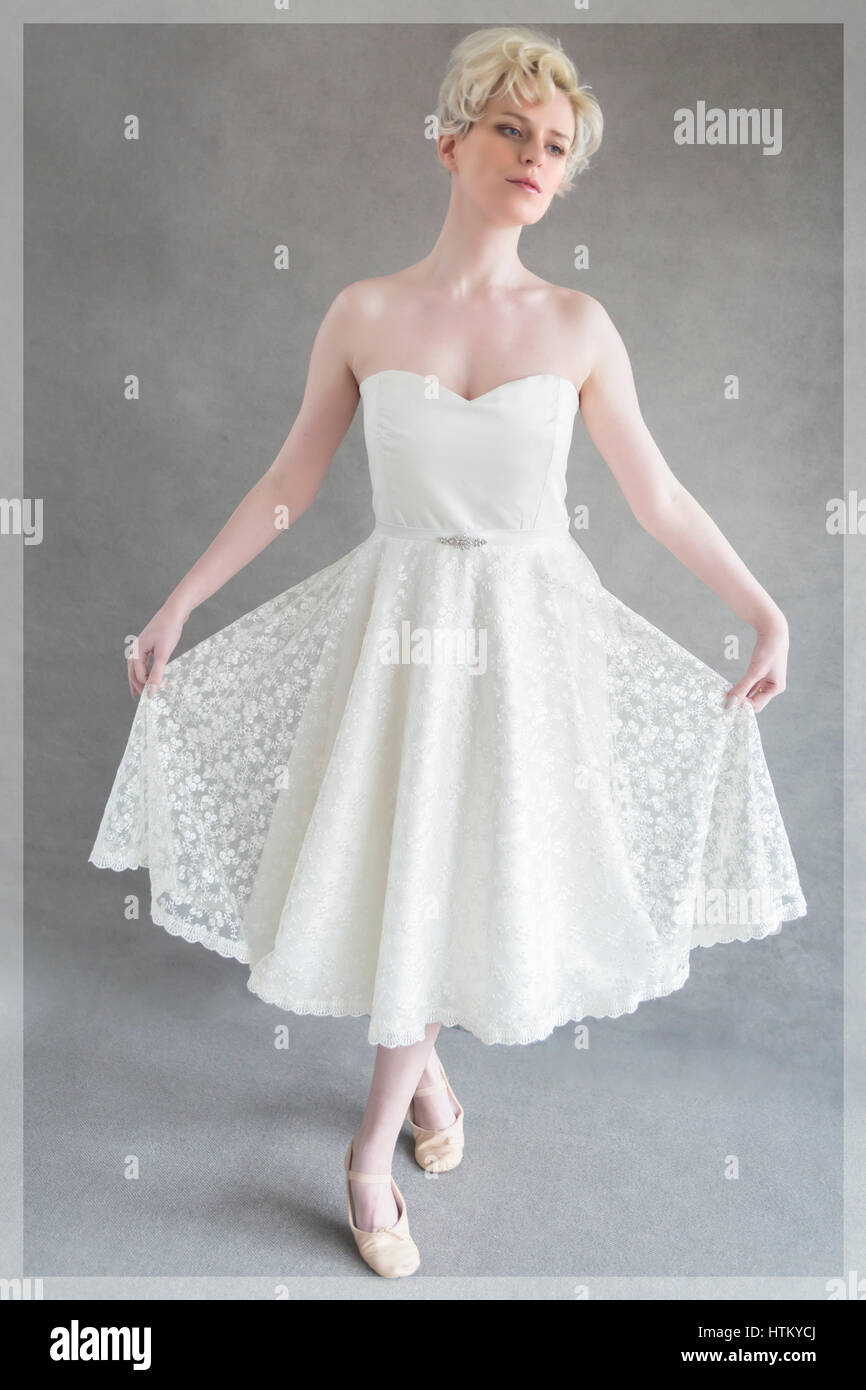 Blonde girl modeling a dress Stock Photo - Alamy