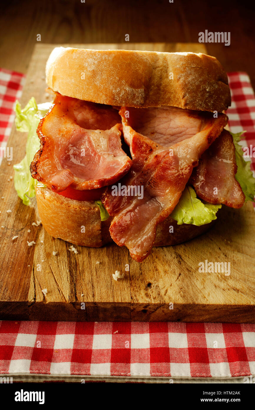 Chunky bacon sandwich on board, studio Stock Photo - Alamy