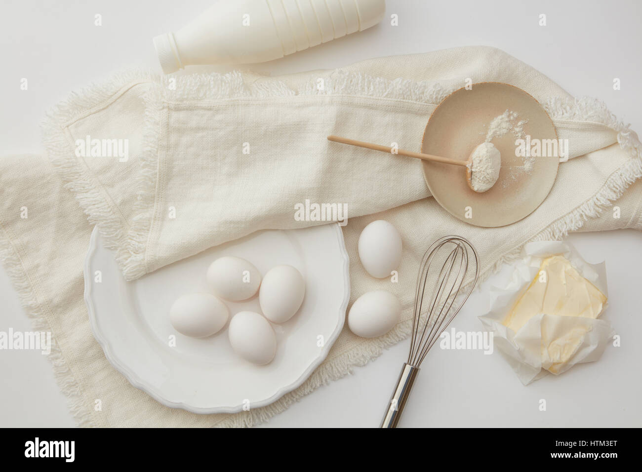Baking ingredients and cooking utensils on white table Stock Photo - Alamy